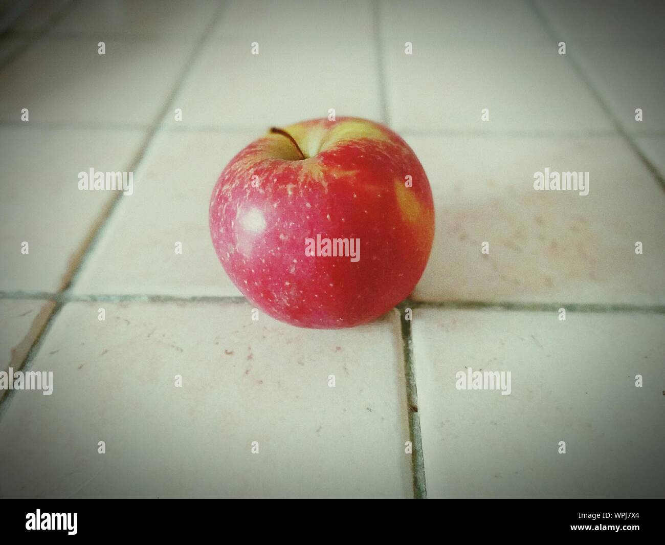 Apple on floor hi-res stock photography and images - Alamy