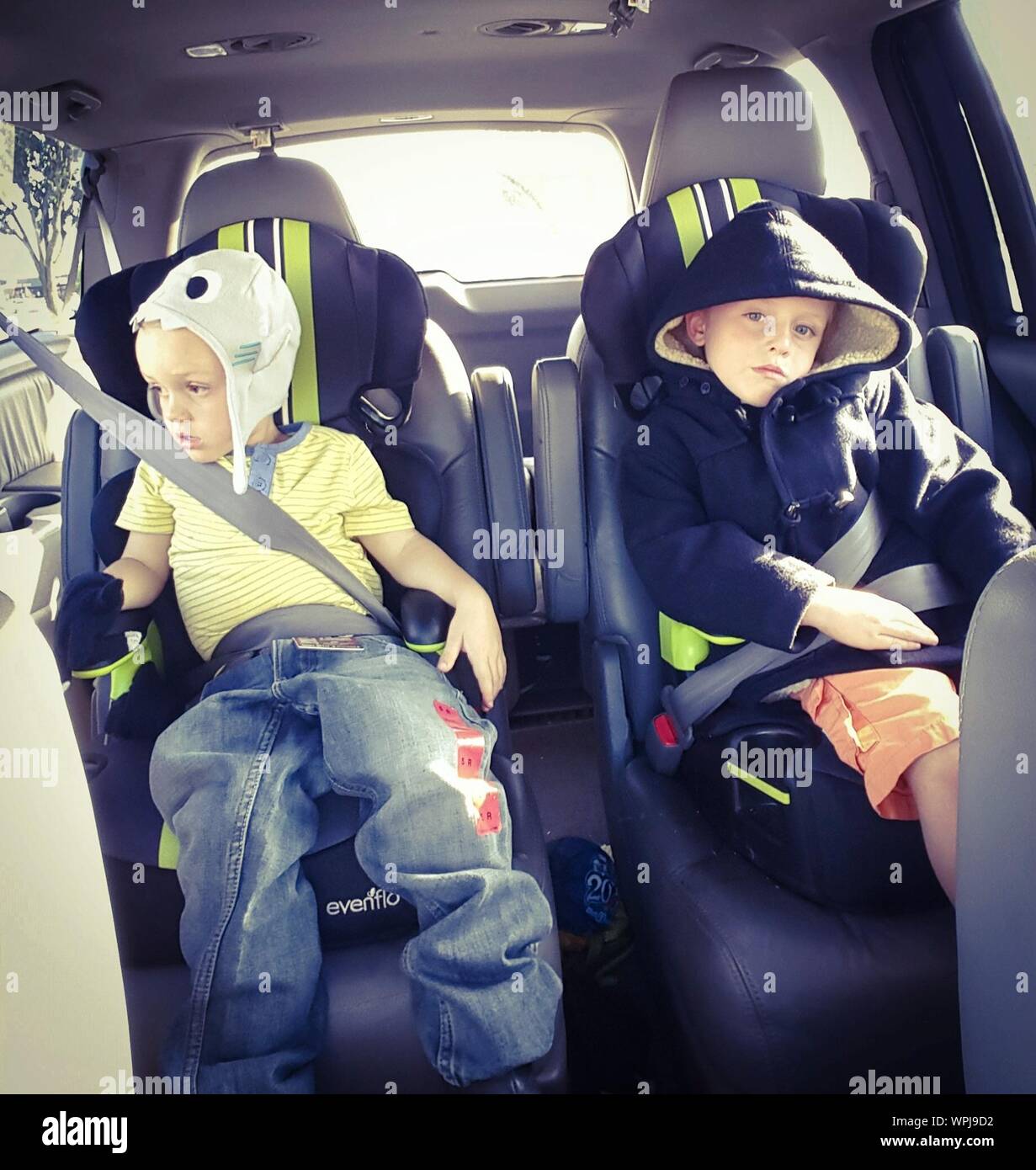 Brothers sitting hi-res stock photography and images - Alamy