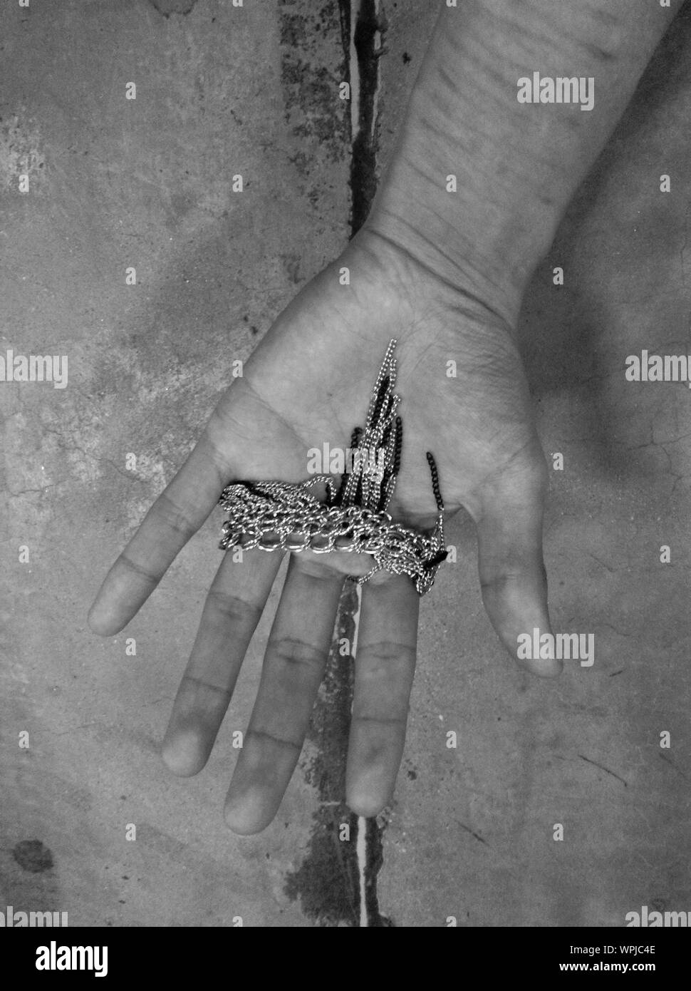 Hand chains hi-res stock photography and images - Alamy