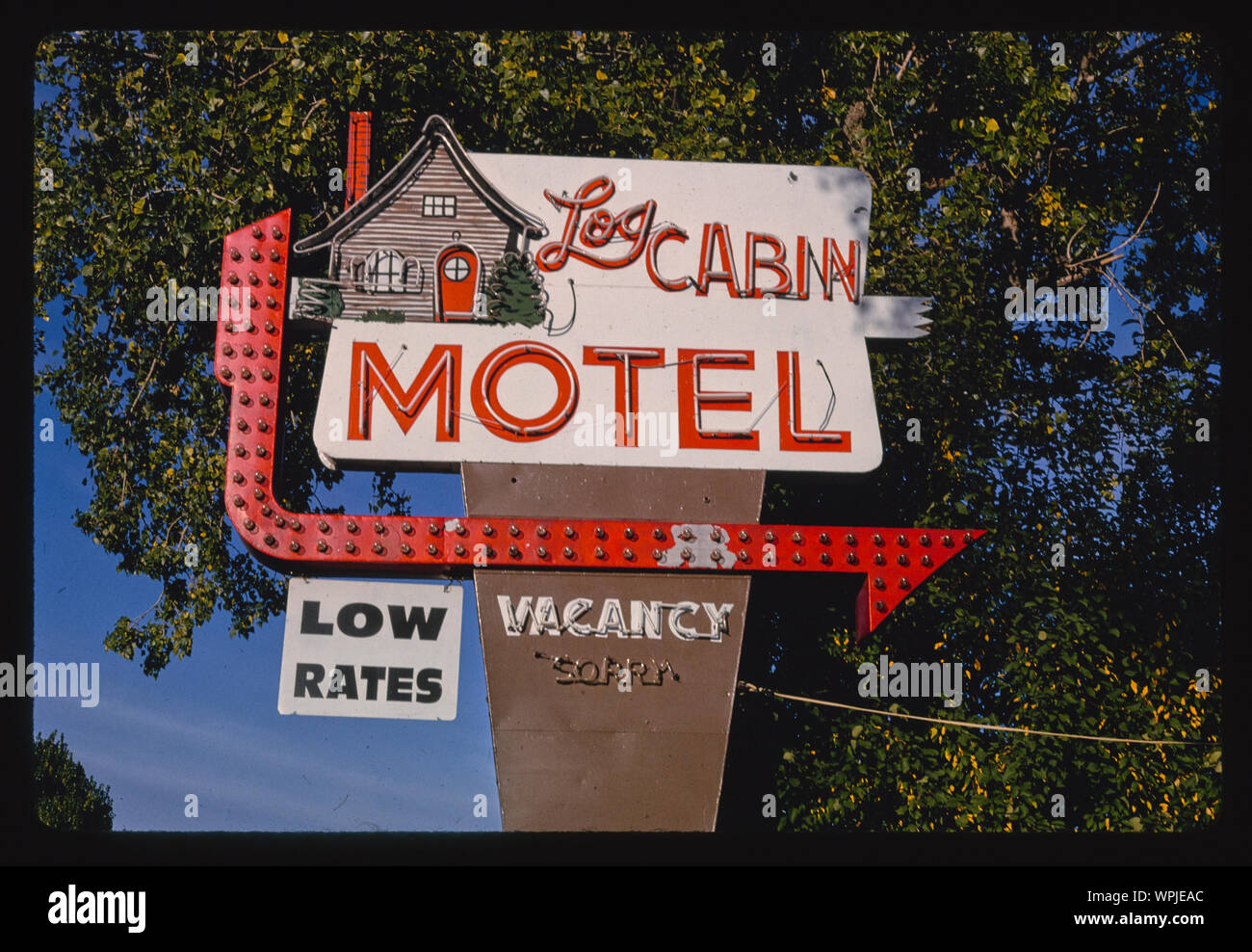 Log Cabin Motel sign, Montrose, Colorado Stock Photo - Alamy