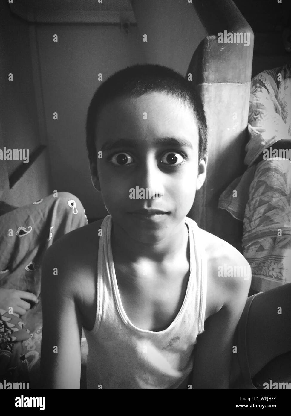 Portrait Of Surprised Boy Making Face At Home Stock Photo - Alamy