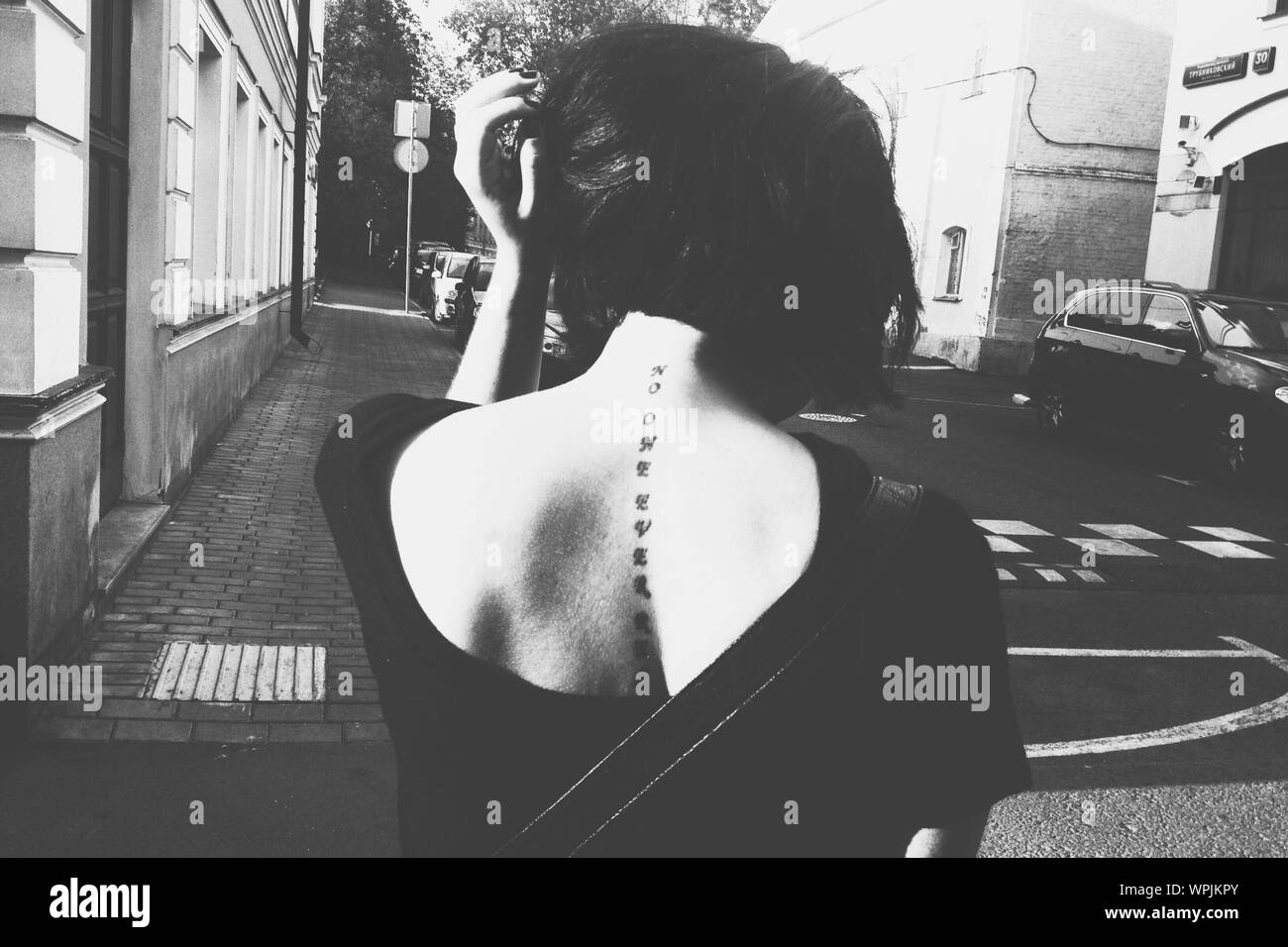 Woman back view walking street hi-res stock photography and images - Alamy