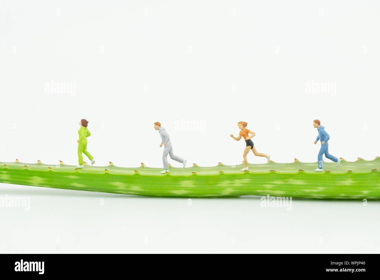 miniature people running Stock Photo - Alamy