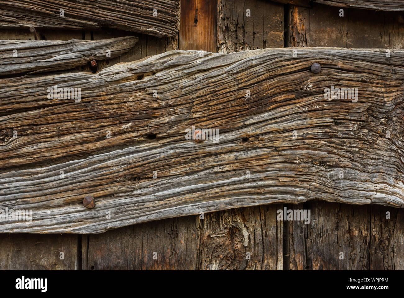 Old wooden boards with iron nails, holes and worn varnish background ...