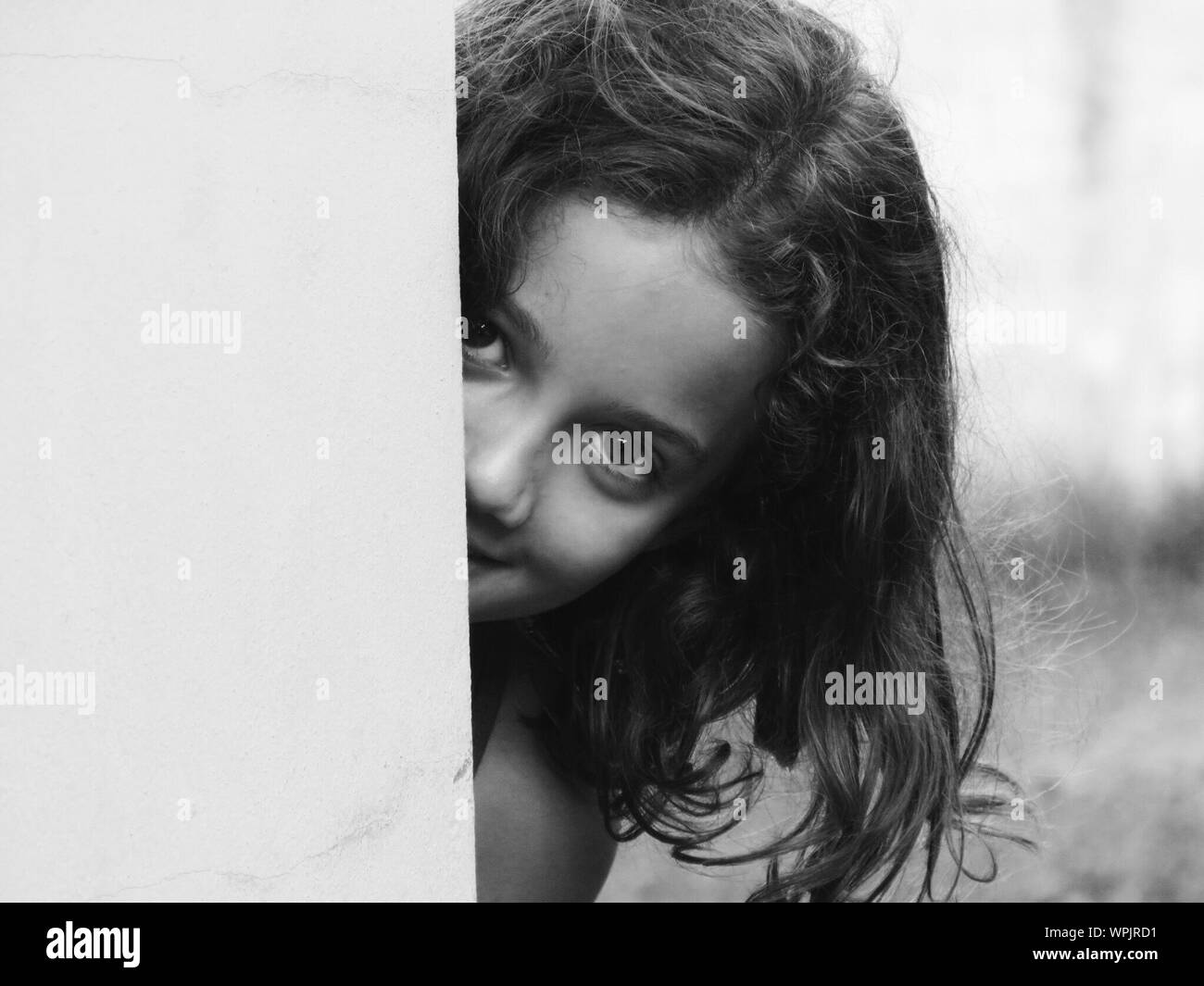Shy girl hiding hi-res stock photography and images - Alamy