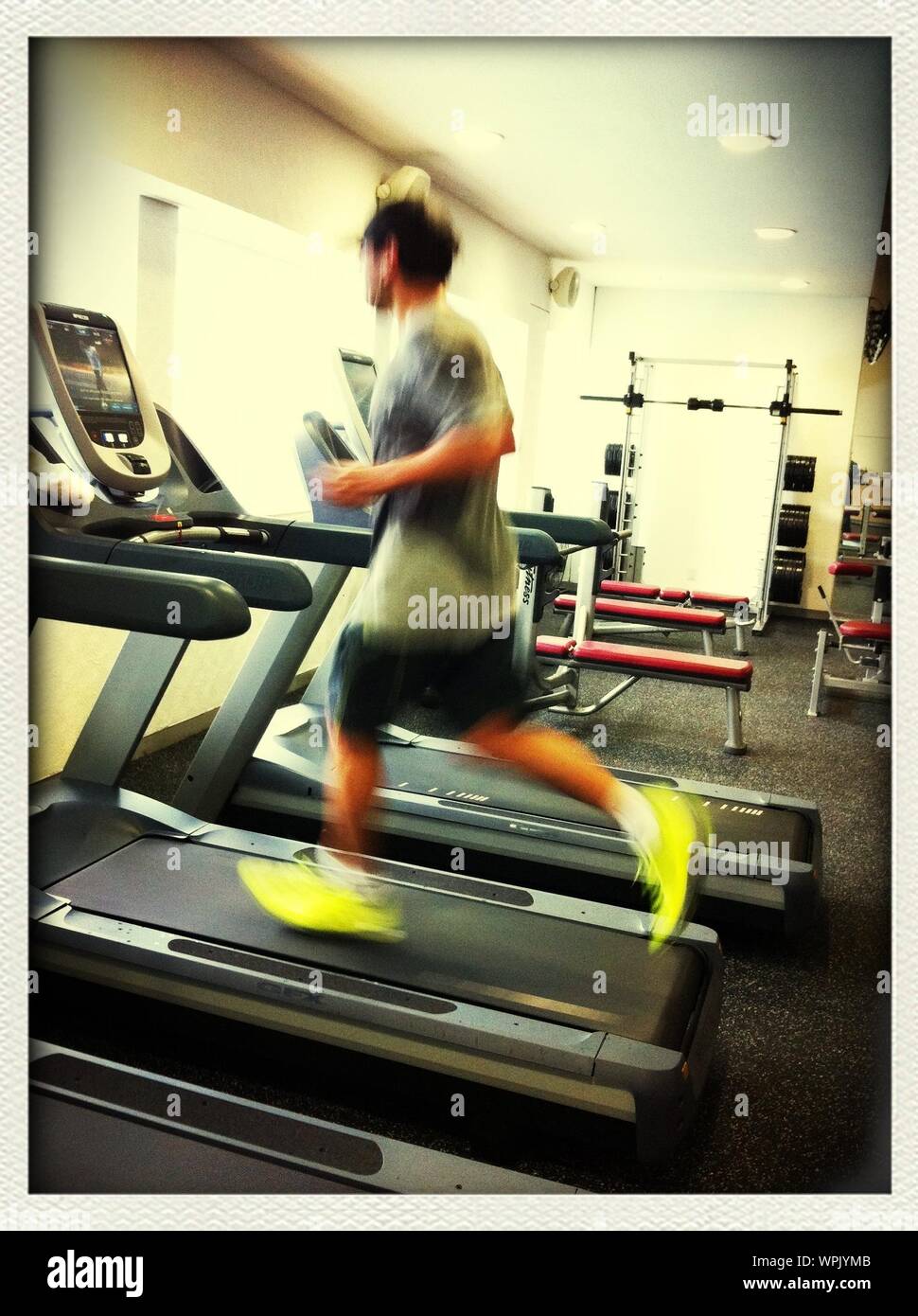 Person on running machine hi-res stock photography and images - Alamy
