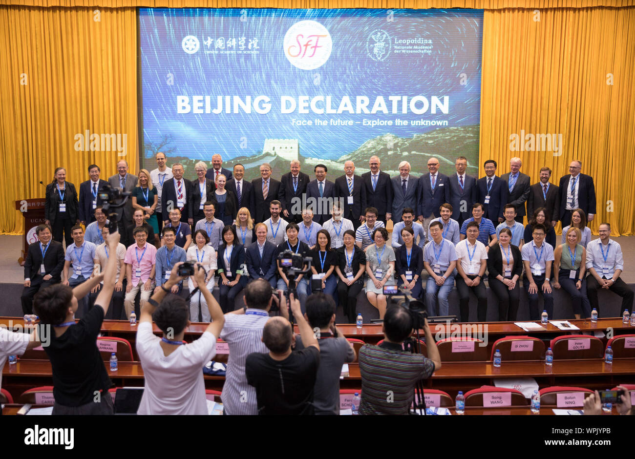 Beijing, China. 9th Sep, 2019. Chinese and German scientists pose for a ...