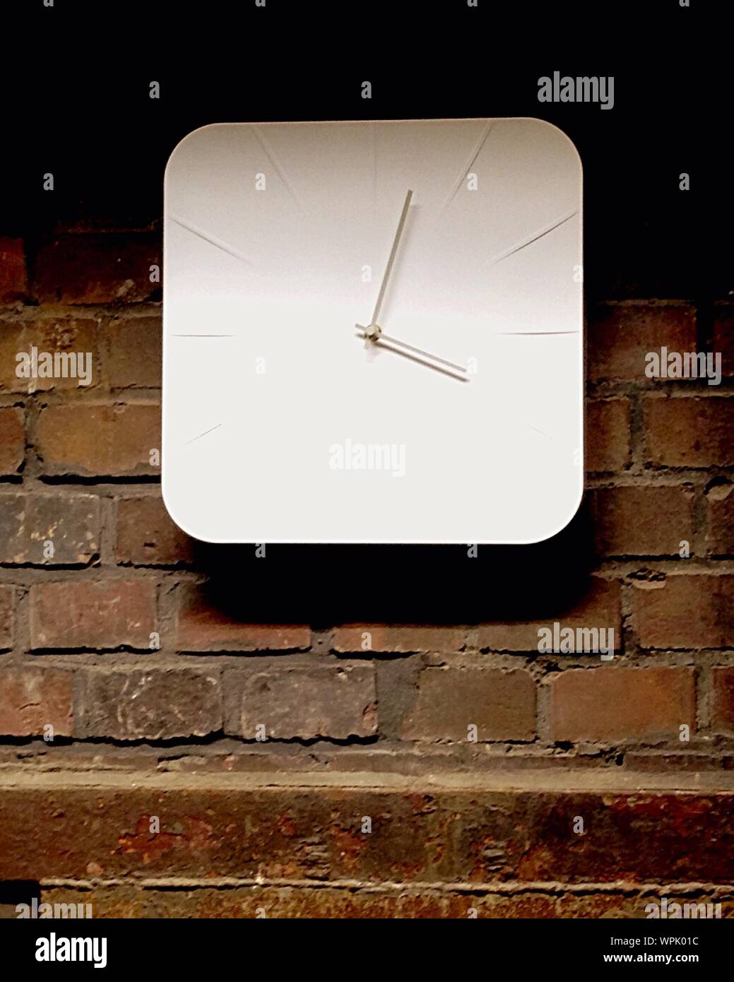 Clock on brick wall hi-res stock photography and images - Alamy