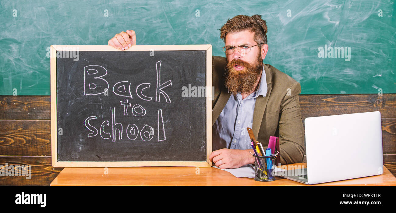 Welcome back. Teacher welcomes new pupils to enter educational ...