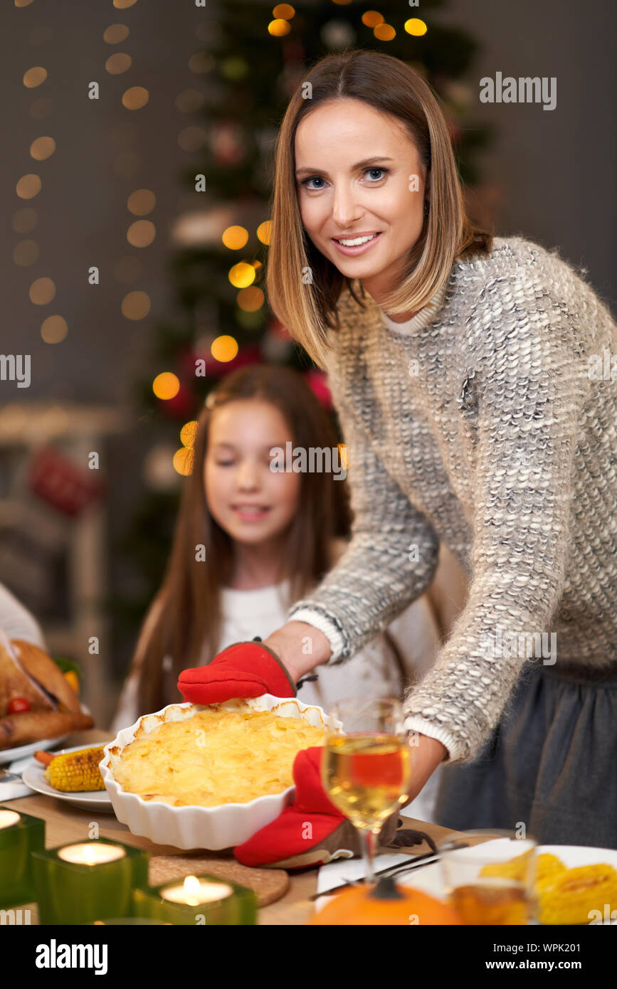 Beautiful family eating Christmas dinner at home Stock Photo - Alamy