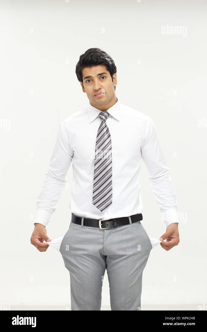 Indian man showing empty pockets hi-res stock photography and images ...