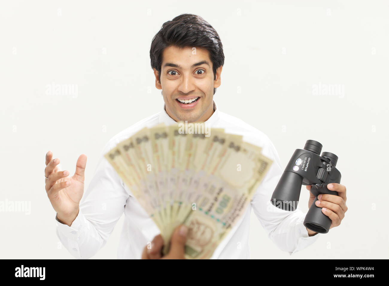 Man excitedly looking at money Stock Photo - Alamy