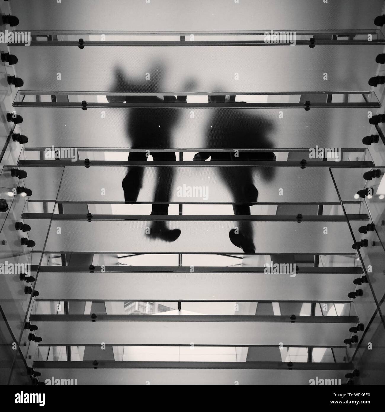 Two people walking down steps hi-res stock photography and images - Alamy