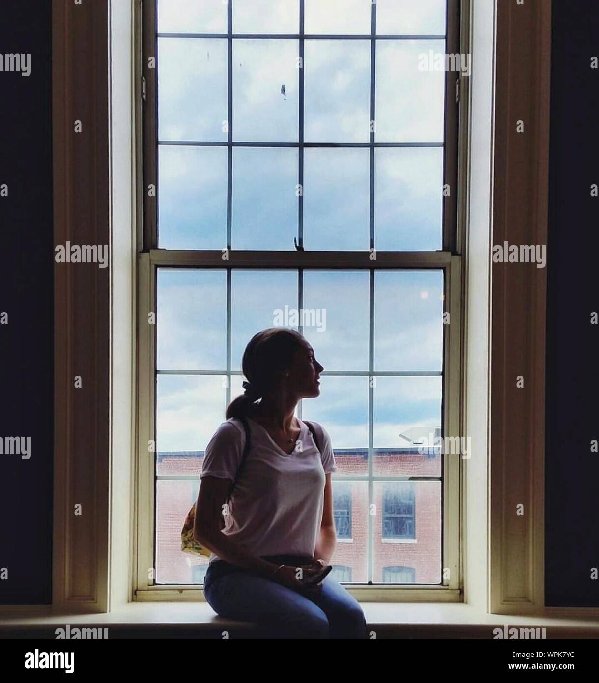 Woman Sitting Window Sill High Resolution Stock Photography and Images ...