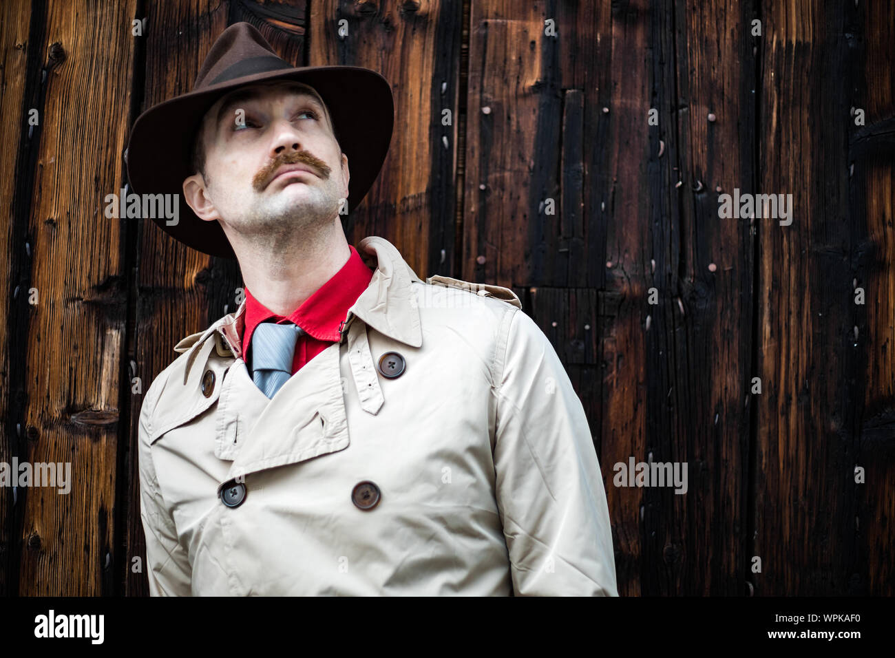 Detective walking in the city slums Stock Photo - Alamy