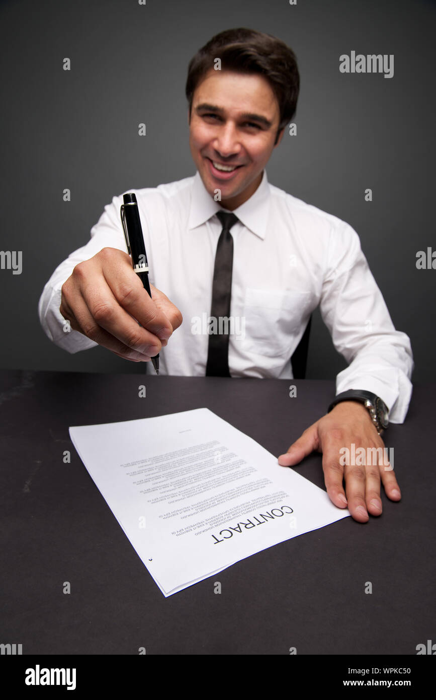 Indian businessman signing document hi-res stock photography and images ...