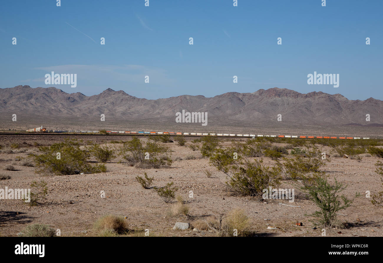 Long train rides through Mojave Desert, California Stock Photo - Alamy