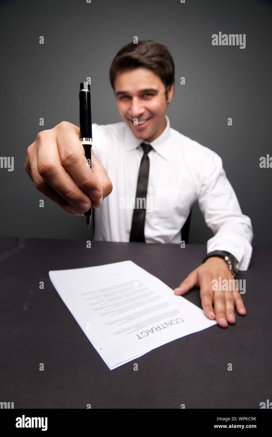 Indian businessman signing document hi-res stock photography and images ...