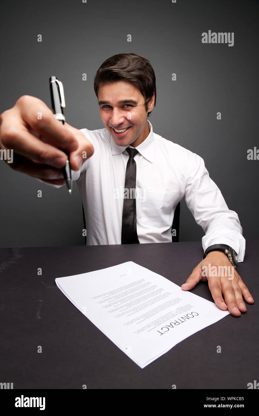 Indian businessman signing document hi-res stock photography and images ...