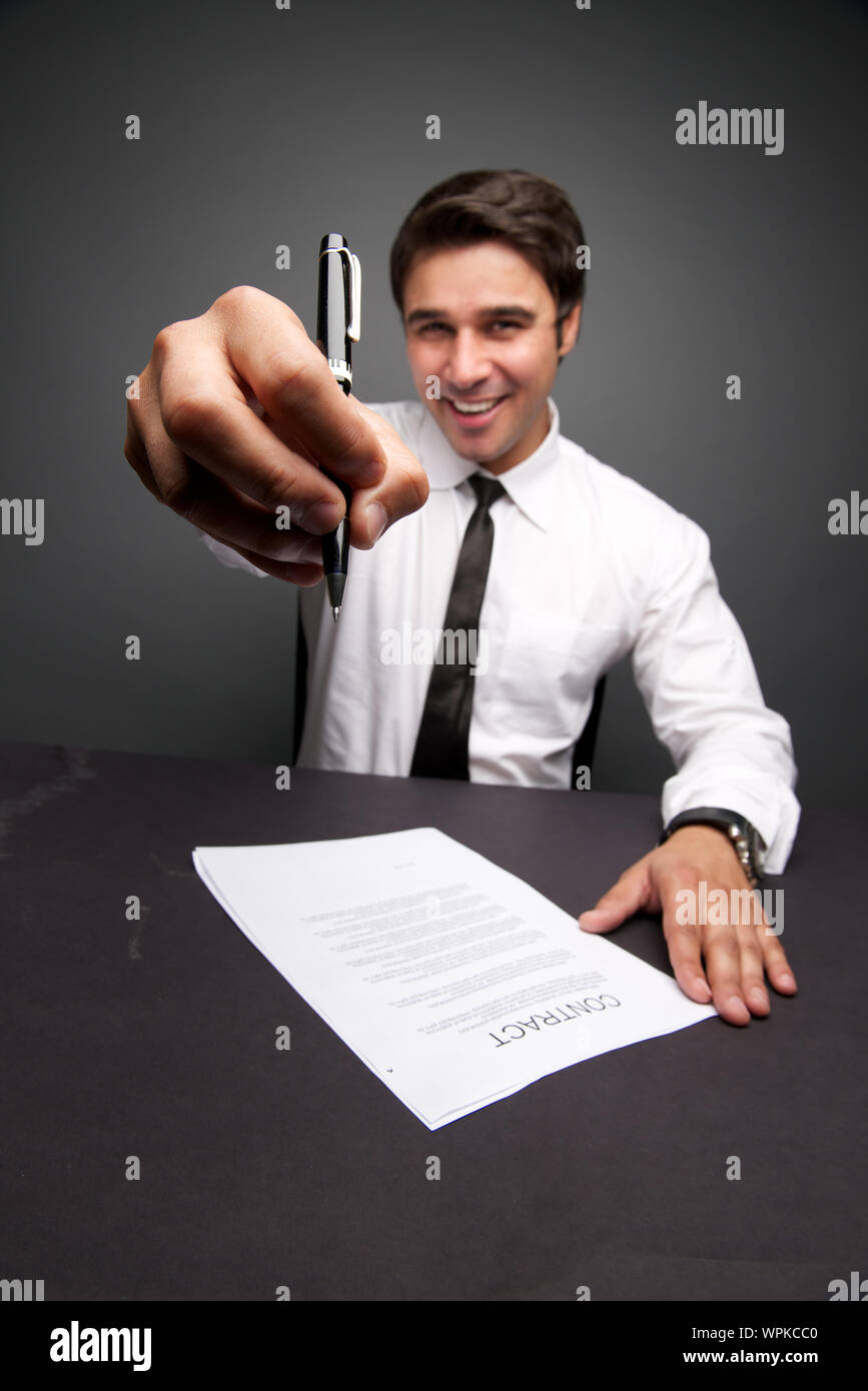 Indian businessman signing document hi-res stock photography and images ...
