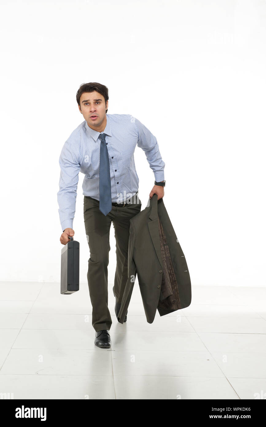 Businessman running with briefcase Stock Photo - Alamy