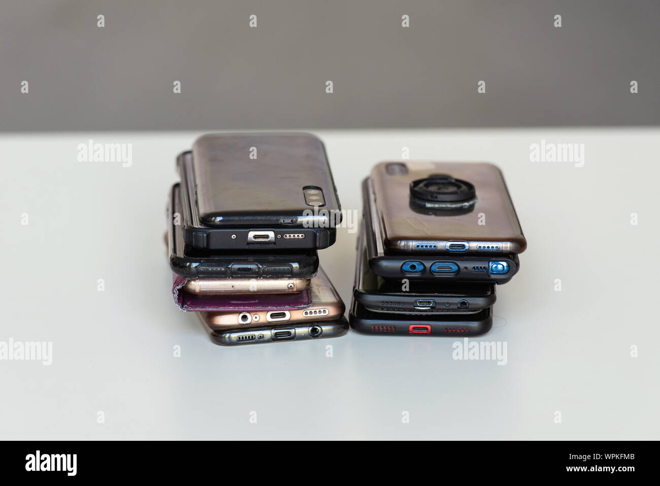 Stack of mobile phones in an office Stock Photo - Alamy