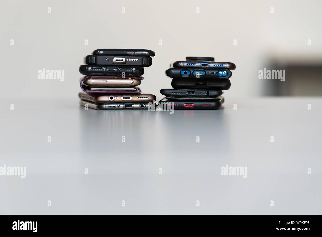 Stack of mobile phones in an office Stock Photo - Alamy