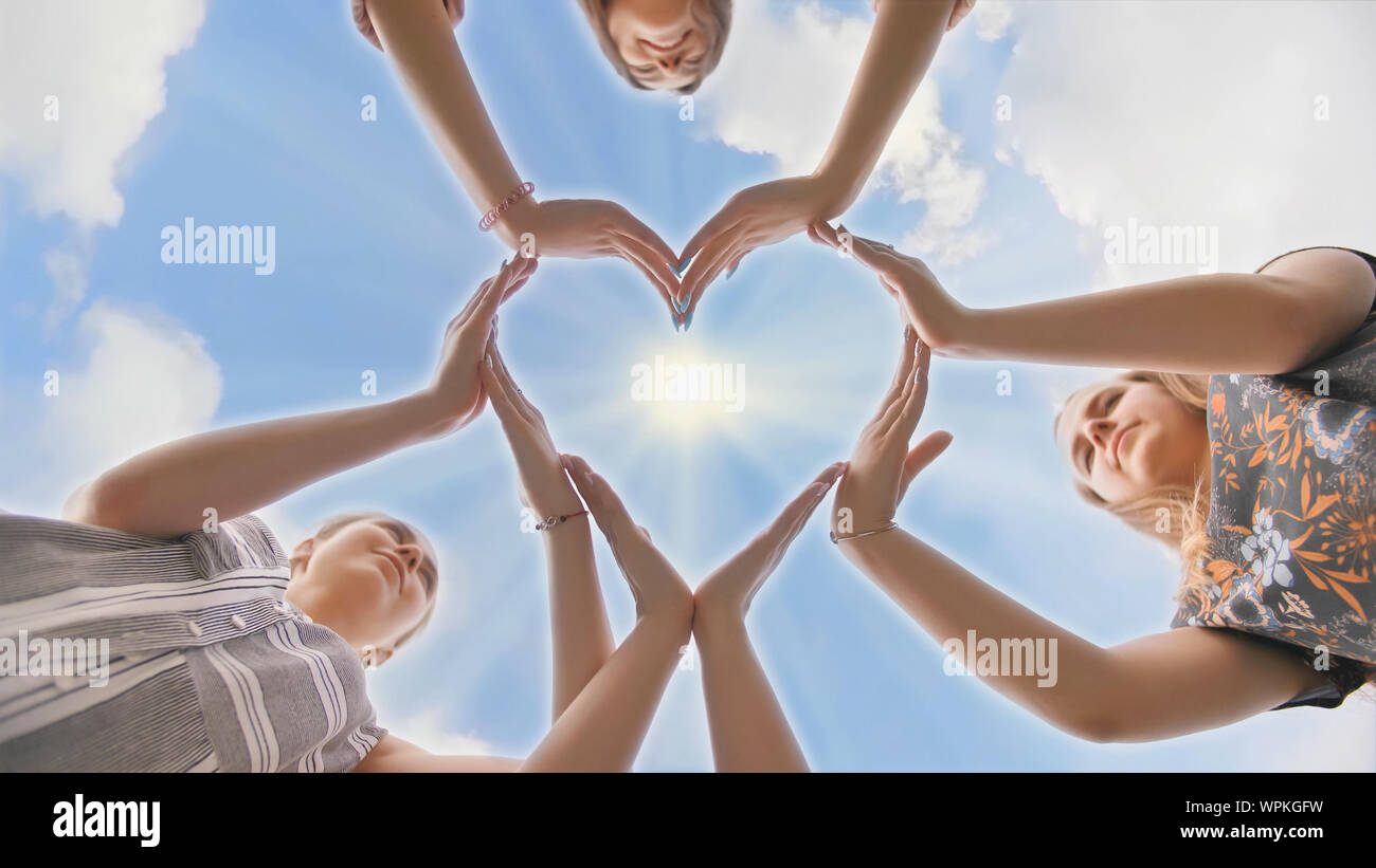 Group youth makes heart shape hi-res stock photography and images - Alamy