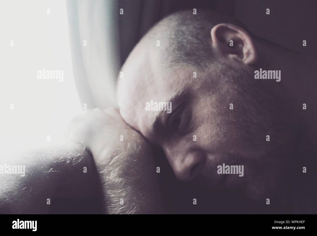 Sad man window hi-res stock photography and images - Alamy