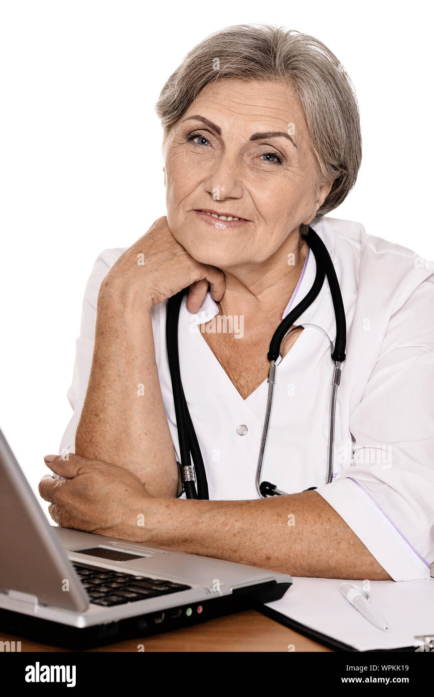 Portrait of confident female doctor sitting at table Stock Photo - Alamy