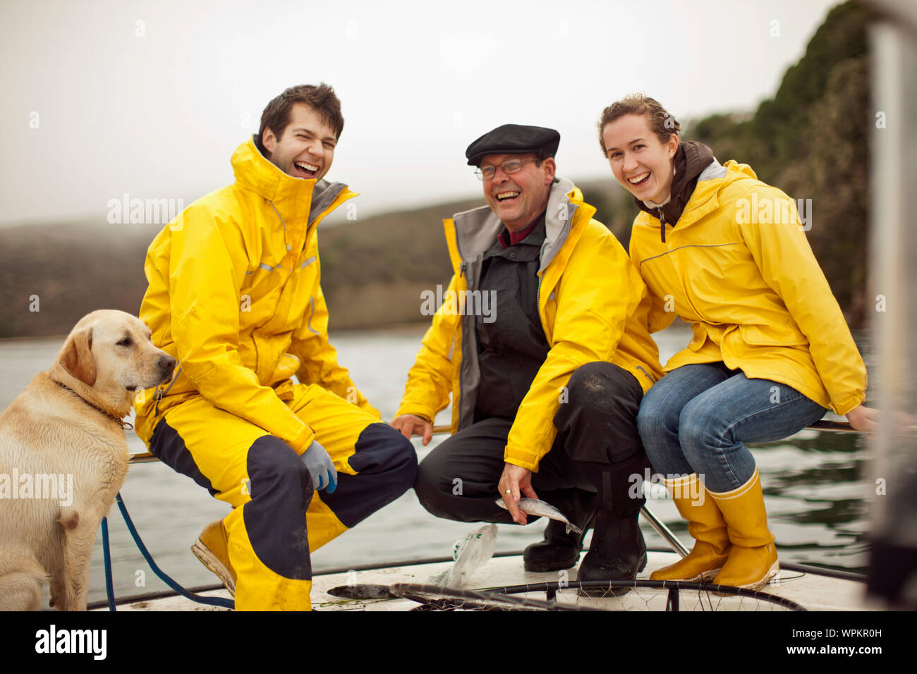 Portrait of three smiling friends on a boat Stock Photo - Alamy