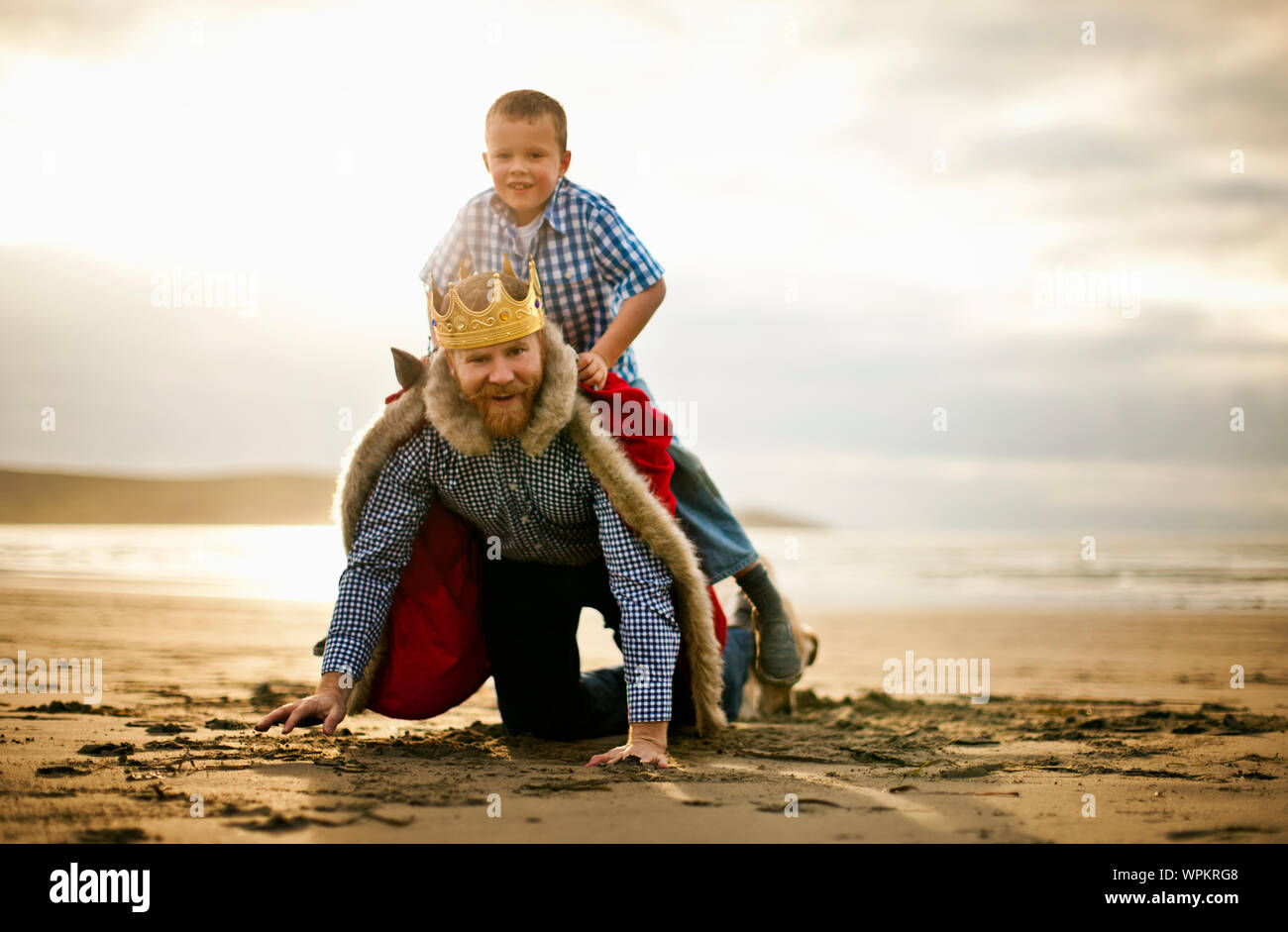 Father Giving Piggy Back Ride To Son High Resolution Stock Photography ...