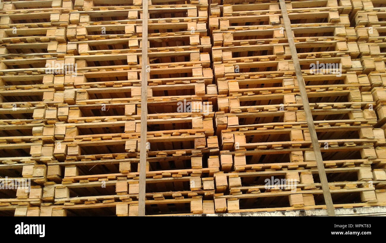 Full Frame Shot Of Stacked Pallets In Warehouse Stock Photo - Alamy