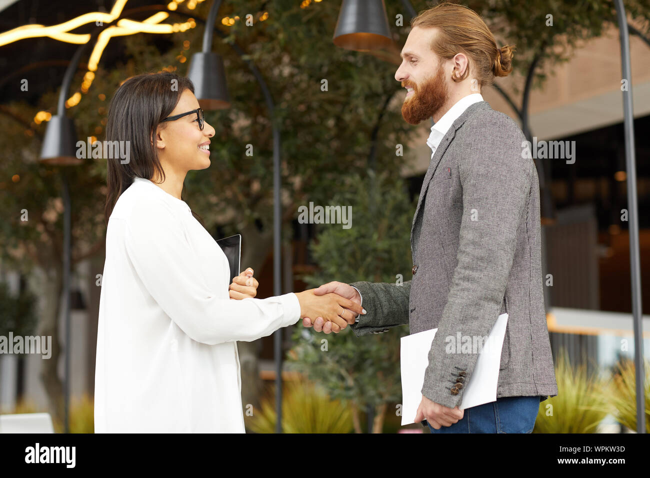 Shaking hands smiling holding communication standing hi-res stock ...