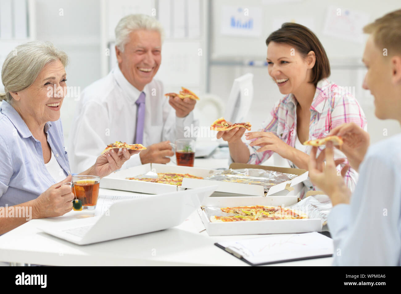Portrait of business people having lunch together Stock Photo - Alamy