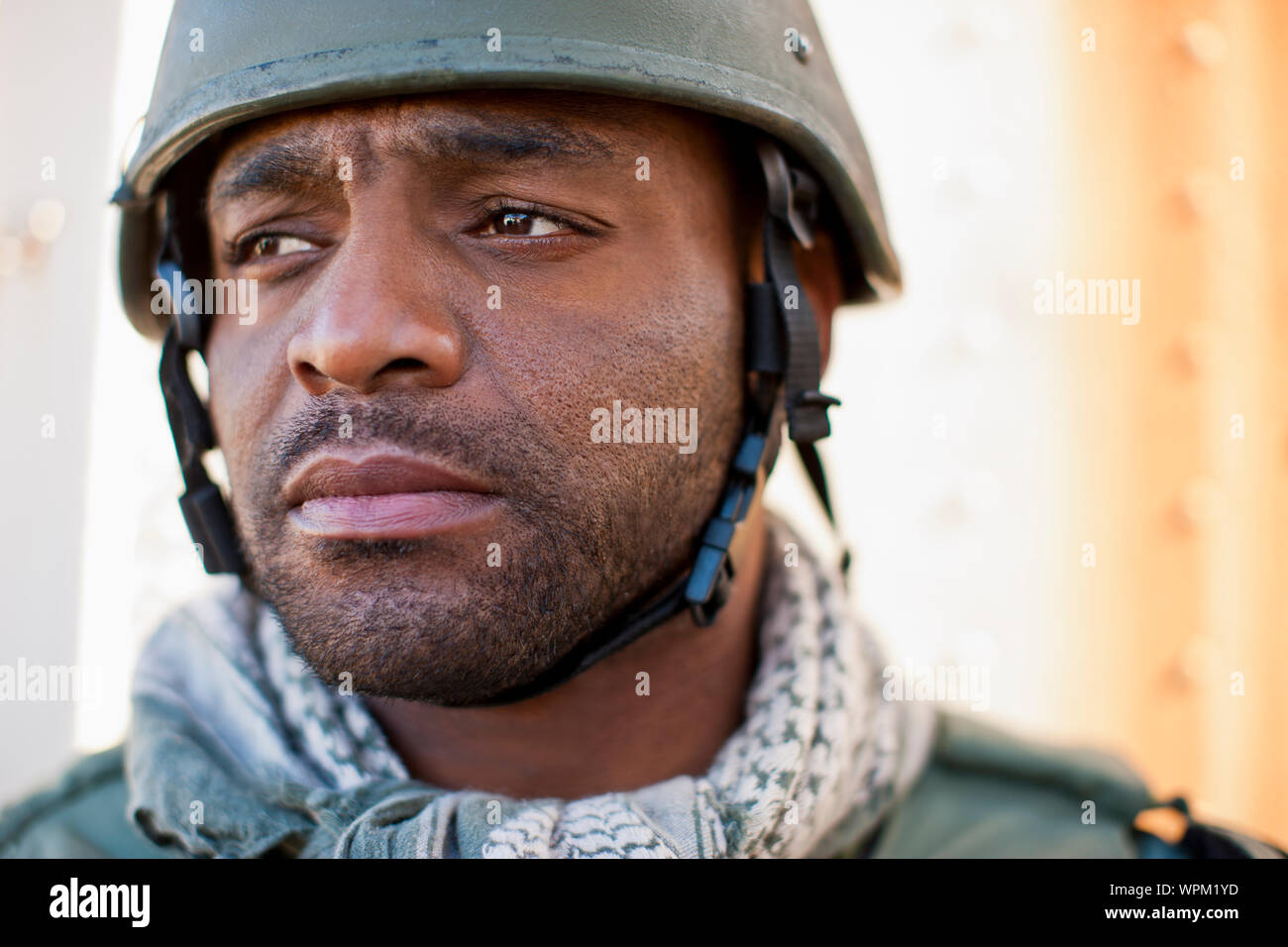 Mid adult man with stubble wearing a protective helmet Stock Photo - Alamy