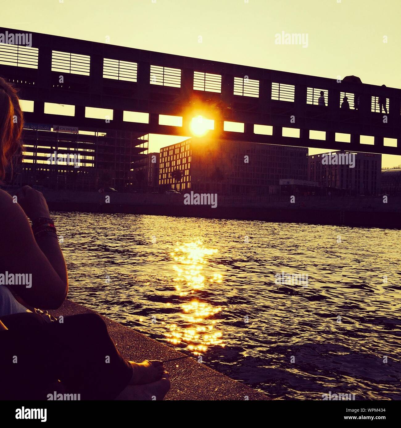 Woman looking across the river hi-res stock photography and images - Alamy