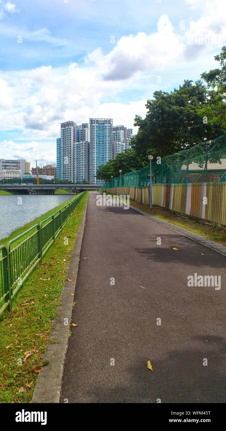 Walkway And River With Buildings In Background Stock Photo - Alamy