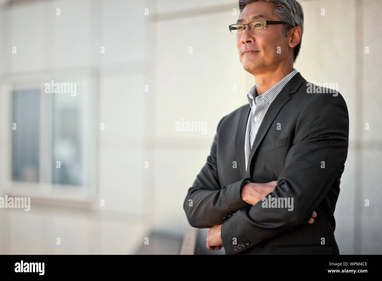 Man stand stands standing on balcony hi-res stock photography and ...
