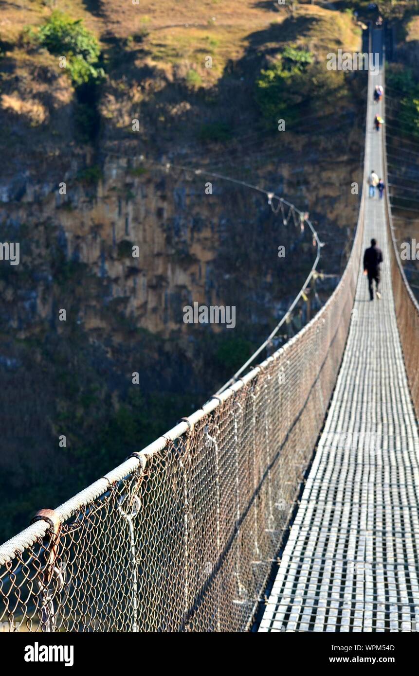 Person Walking On Rope Bridge High Resolution Stock Photography and ...