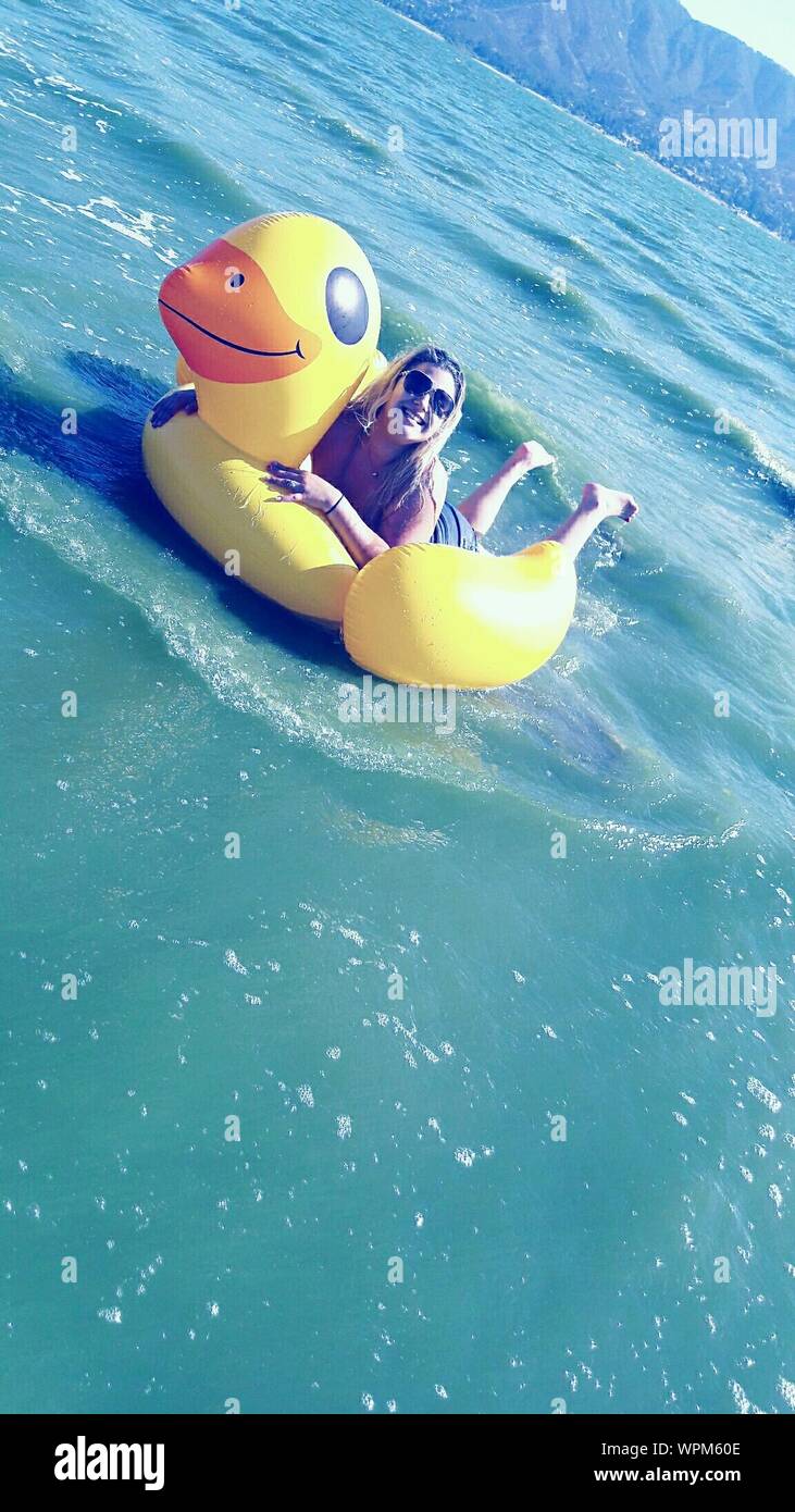 Woman on inflatable raft pool hi-res stock photography and images - Alamy