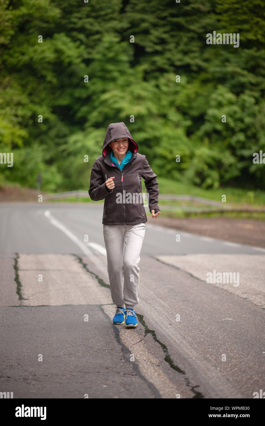 Woman 40s running road hi-res stock photography and images - Alamy