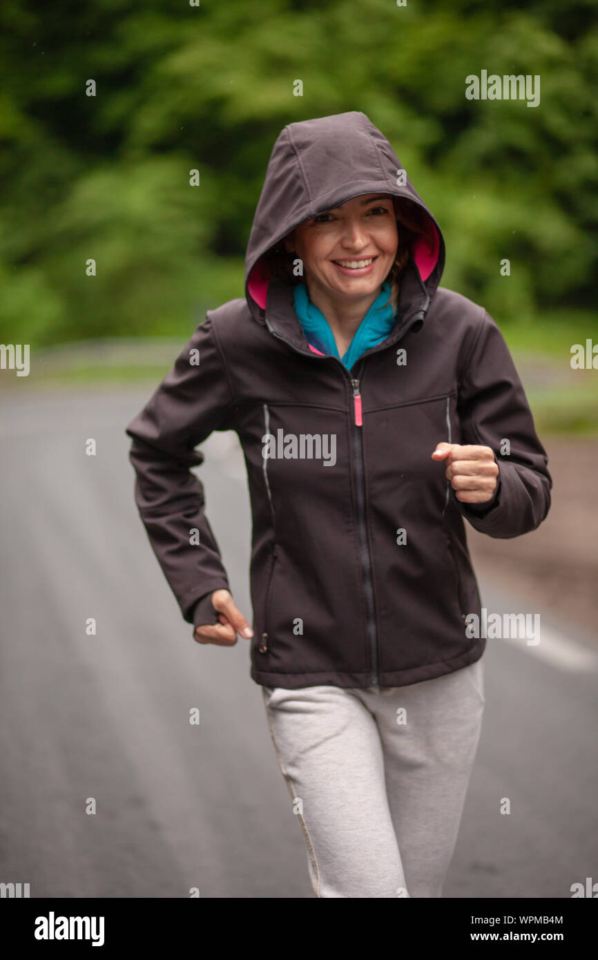 Woman 40s running road hi-res stock photography and images - Alamy