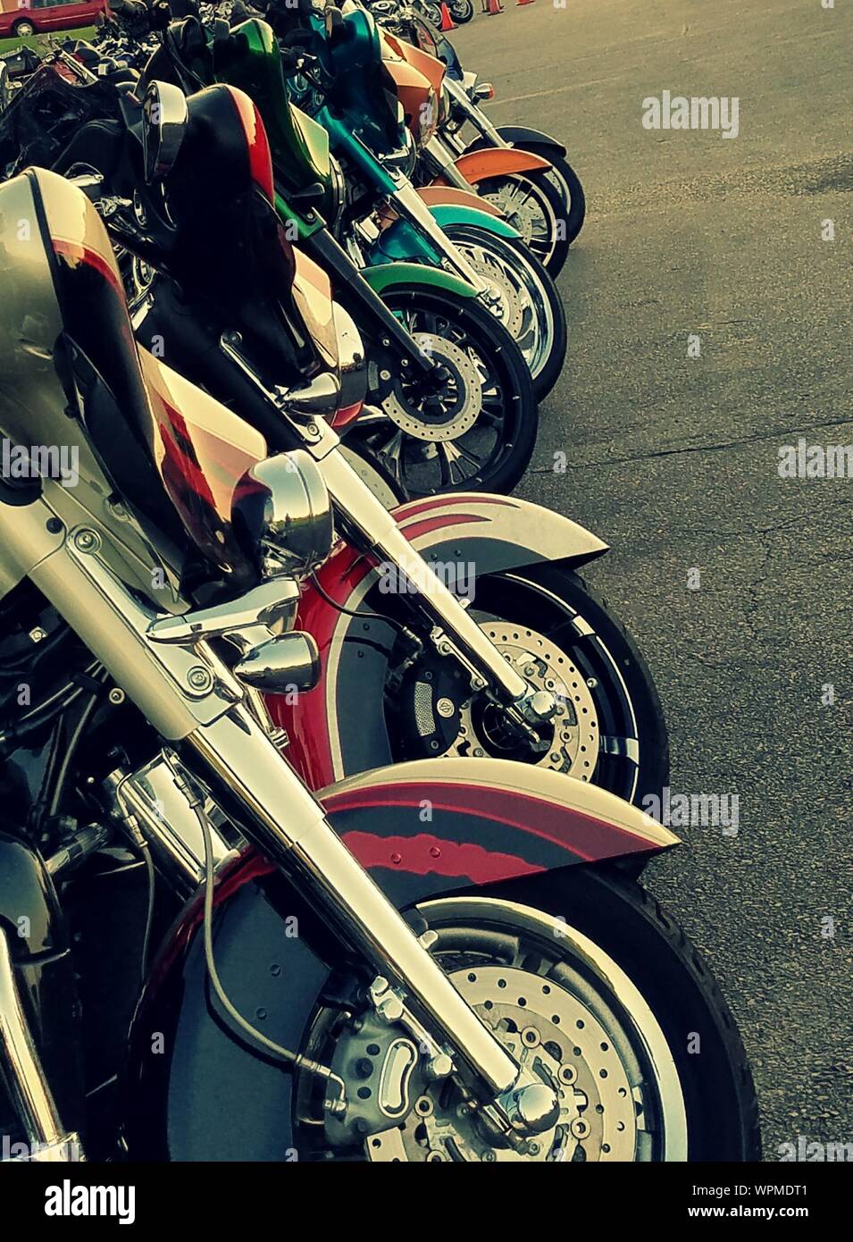 Motorcycles In Row Parked On Street Stock Photo - Alamy