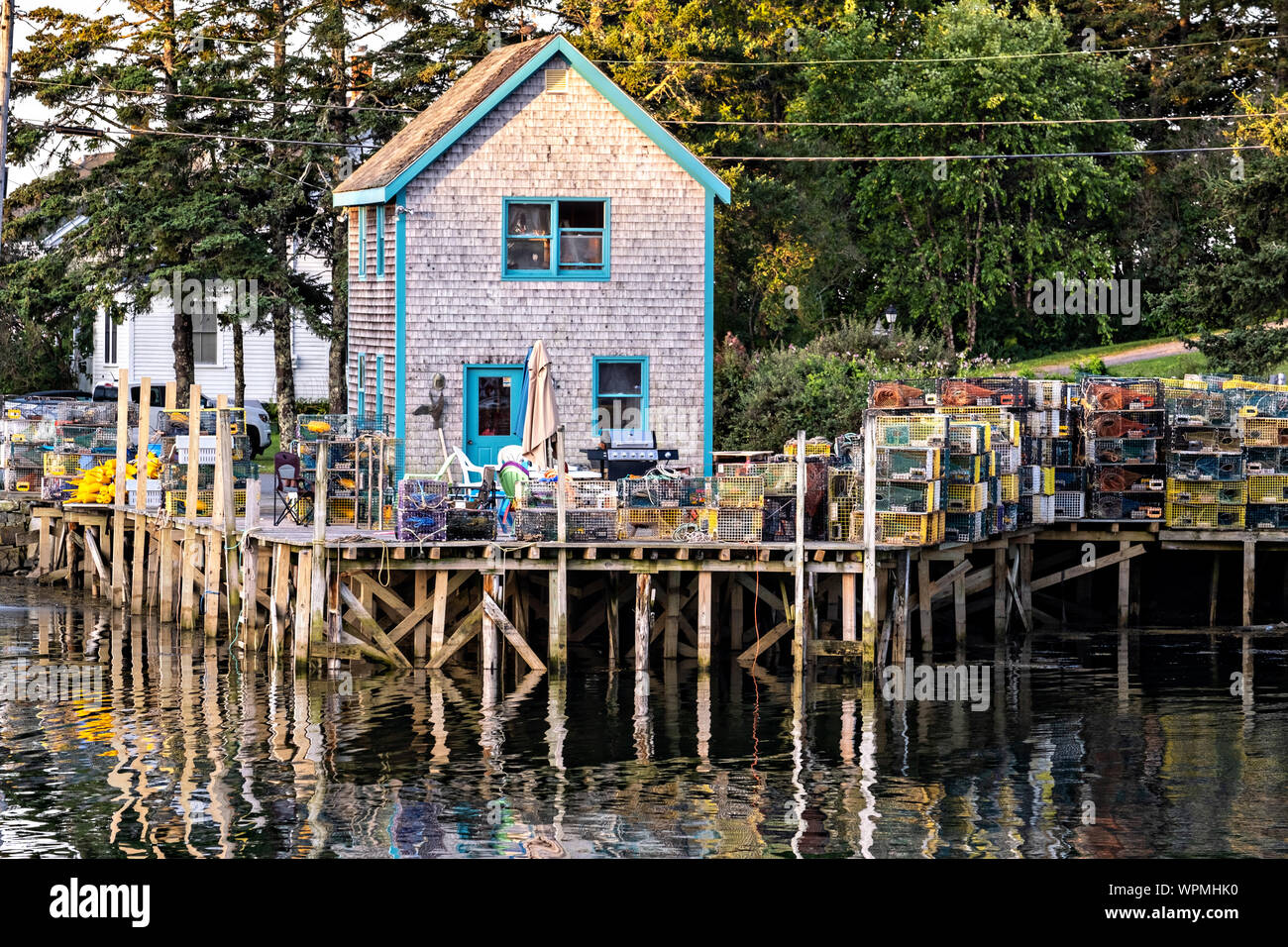 Lobster docks and pier piled high with traps in the quaint fishing ...