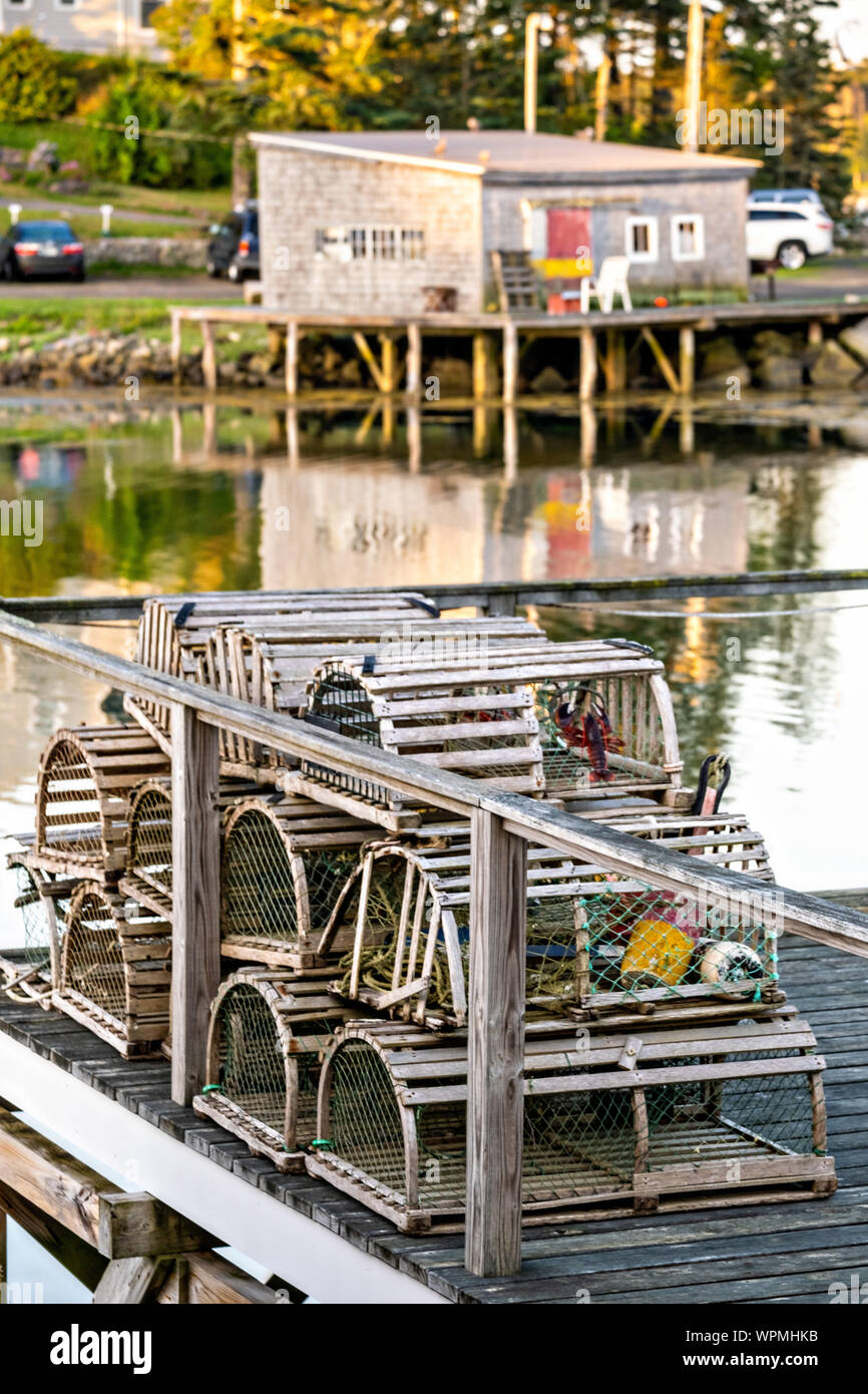 Lobster docks and pier piled high with traps in the quaint fishing ...