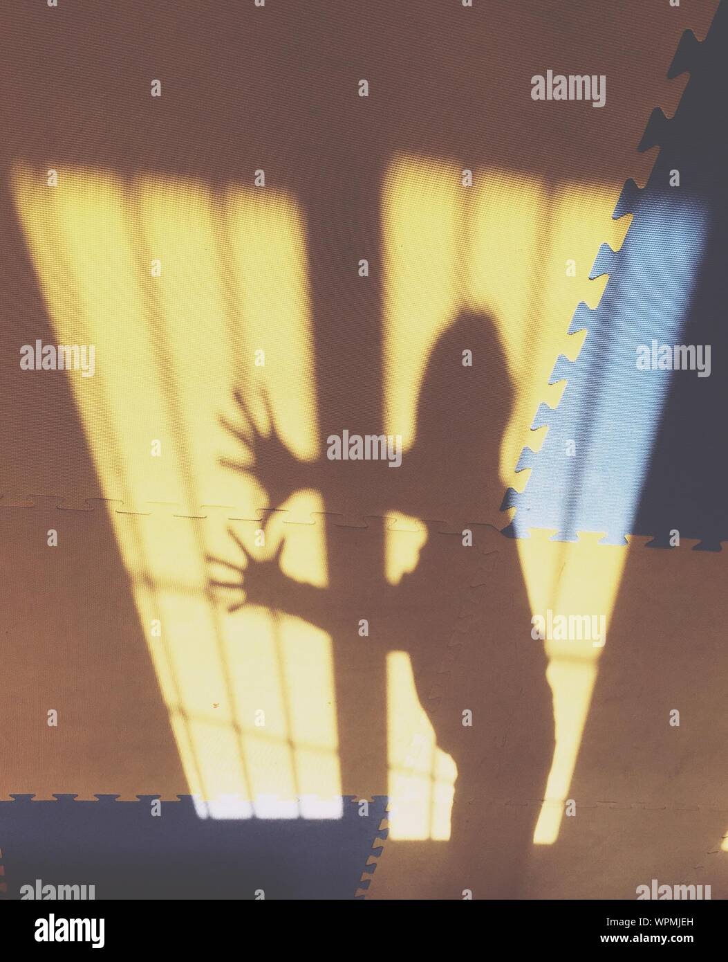 Boy wall standing shadow hi-res stock photography and images - Alamy