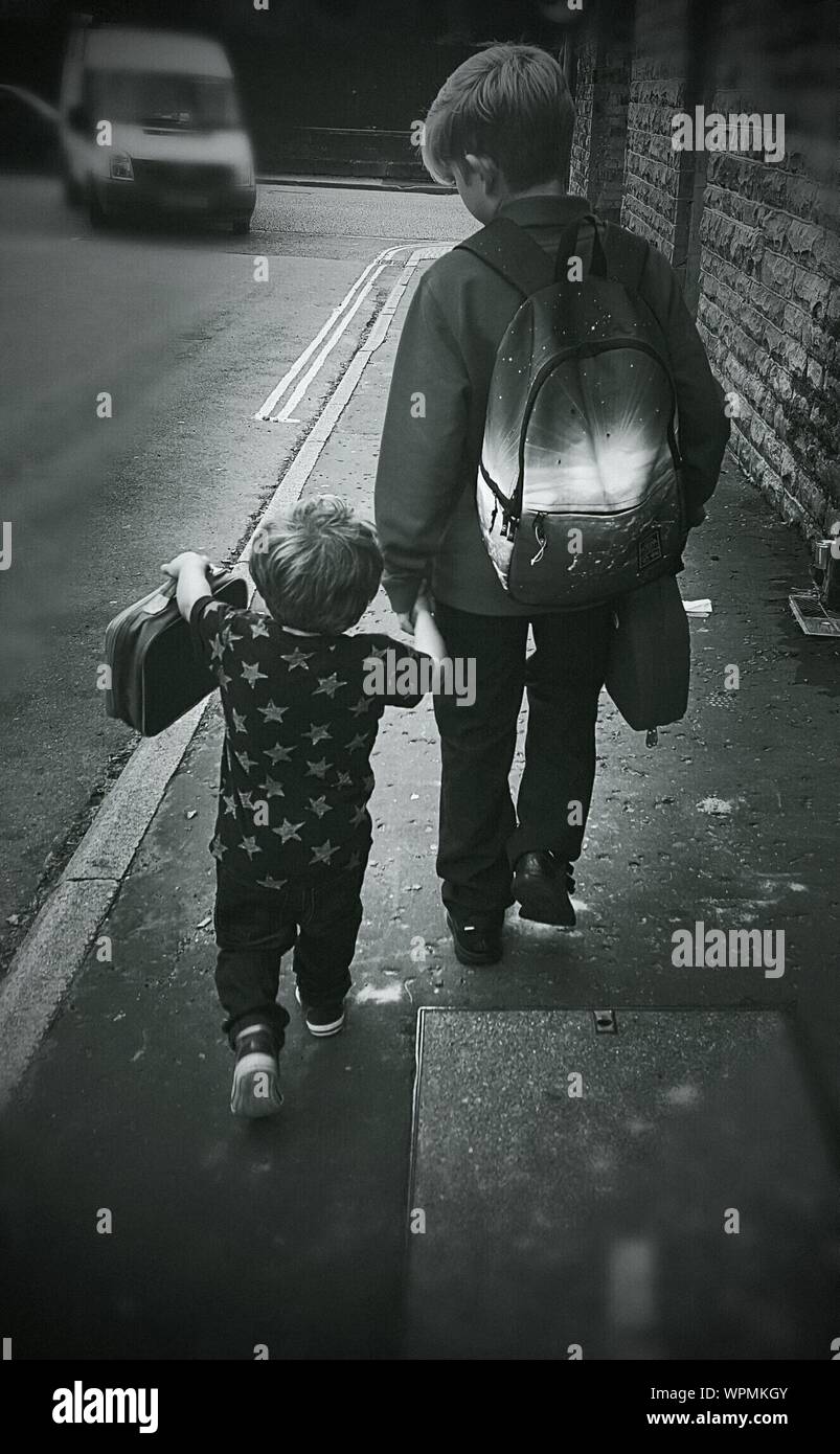 Boys walking to elementary school hi-res stock photography and images ...