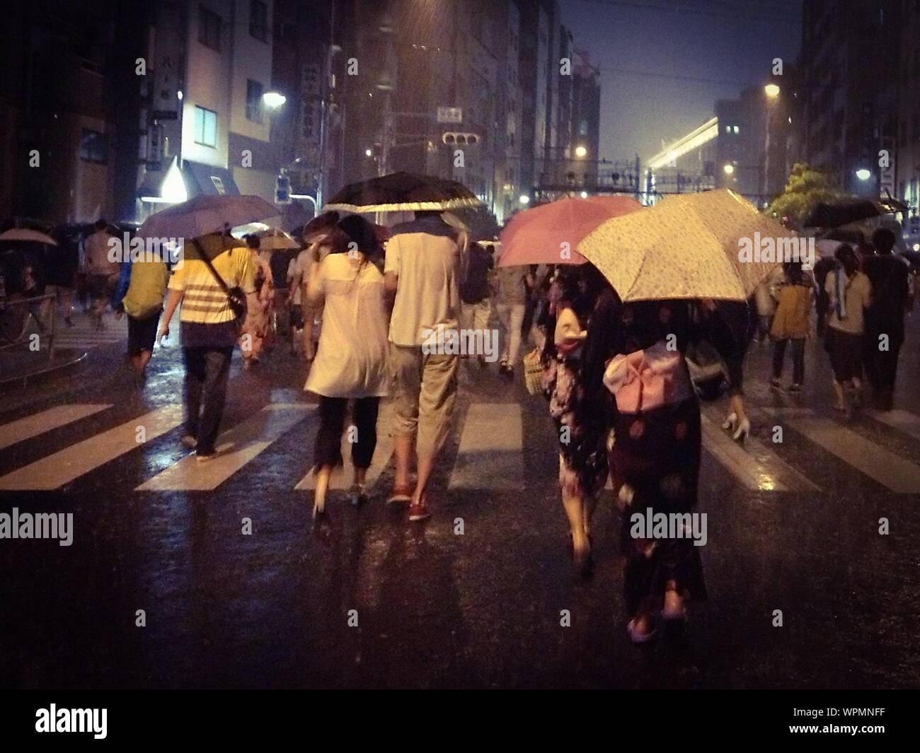 Rainy season umbrella crowd hi-res stock photography and images - Alamy