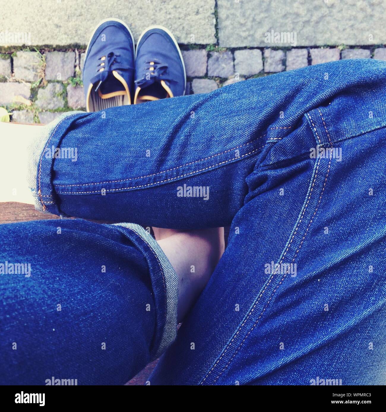 Folded Legs High Resolution Stock Photography and Images - Alamy